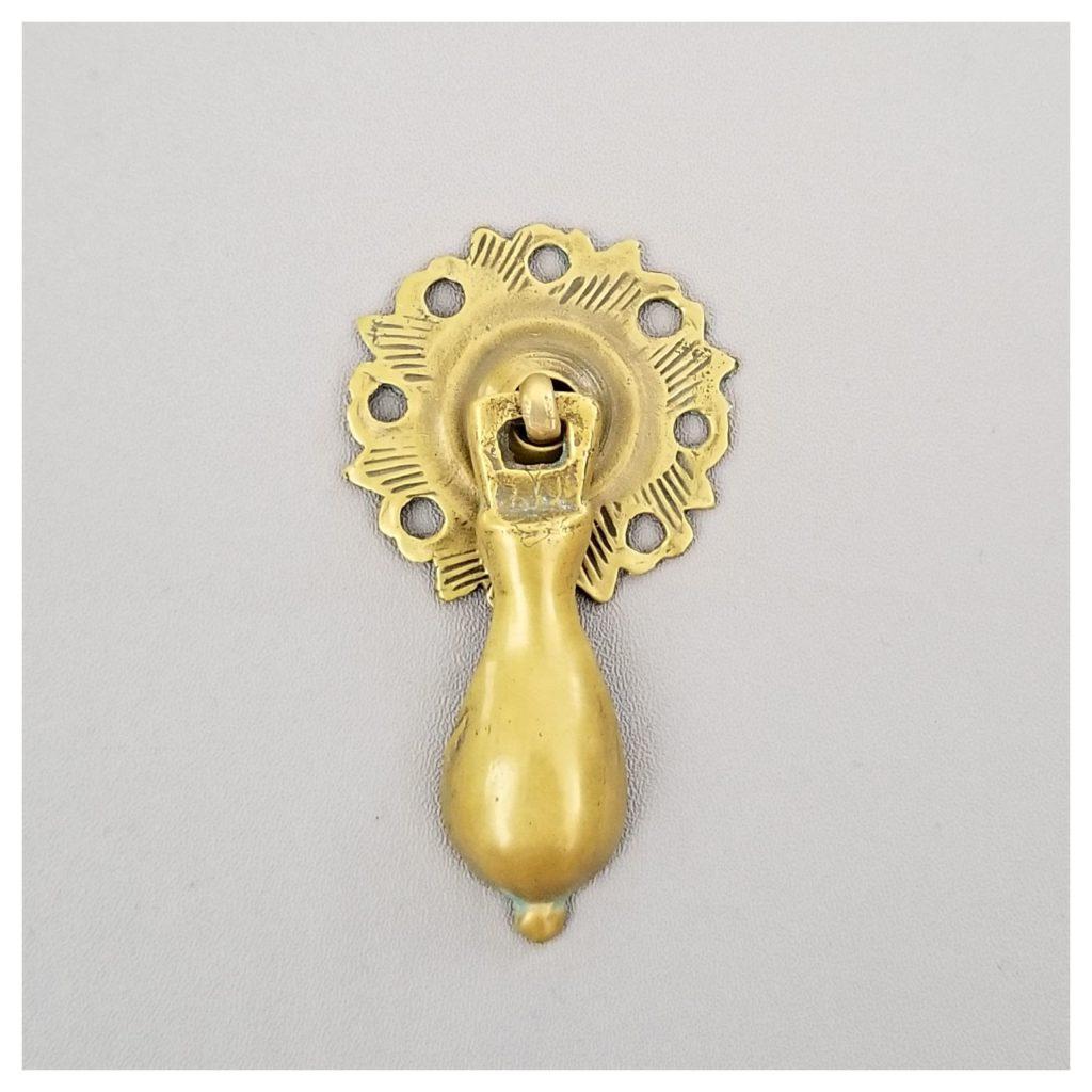 Brass fish tail, pear drop and teardrop handles, drawer pulls